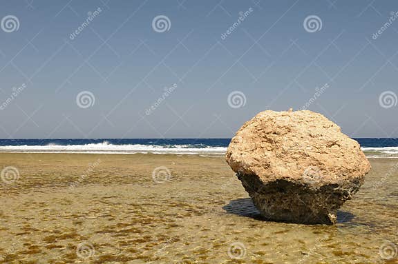 Boulder on beach by ocean stock image. Image of single - 6571039