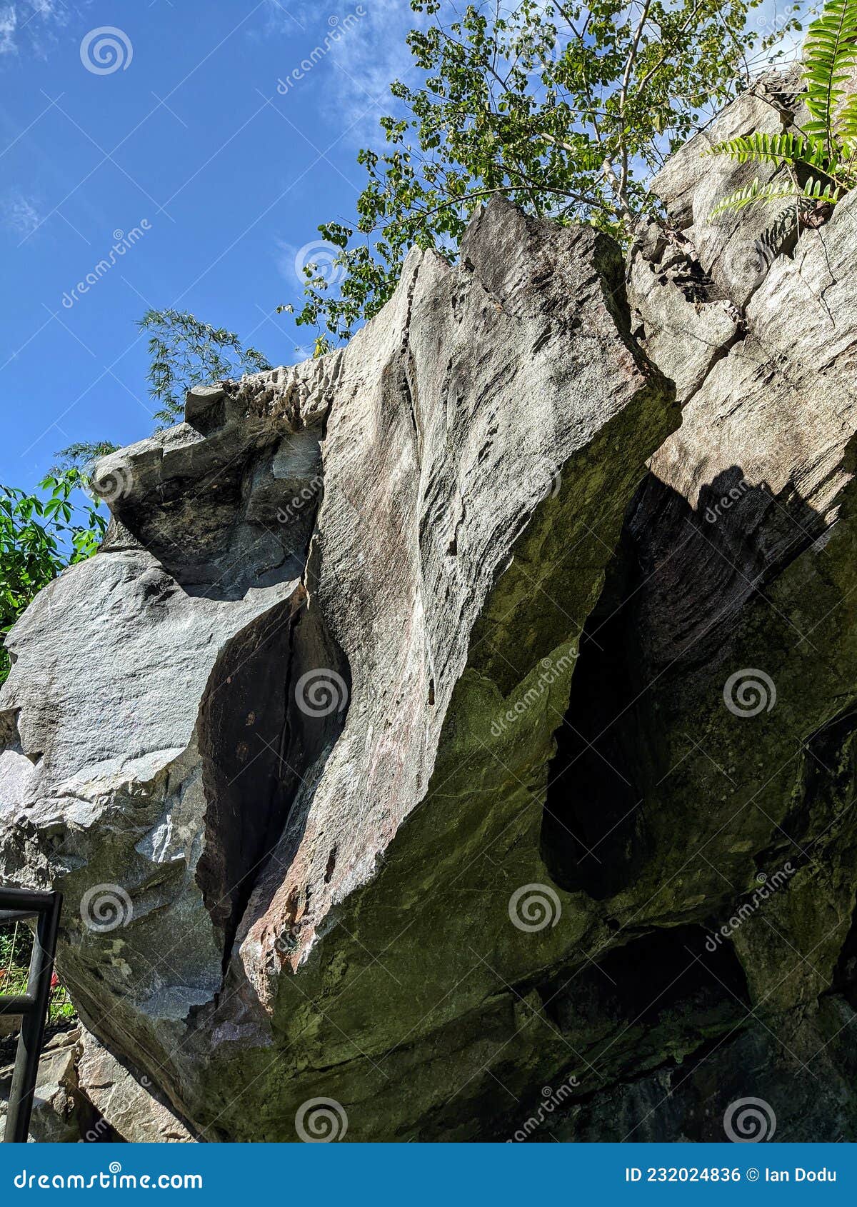 Boulder in Forest Against Blue Sky Background Stock Photo - Image of ...