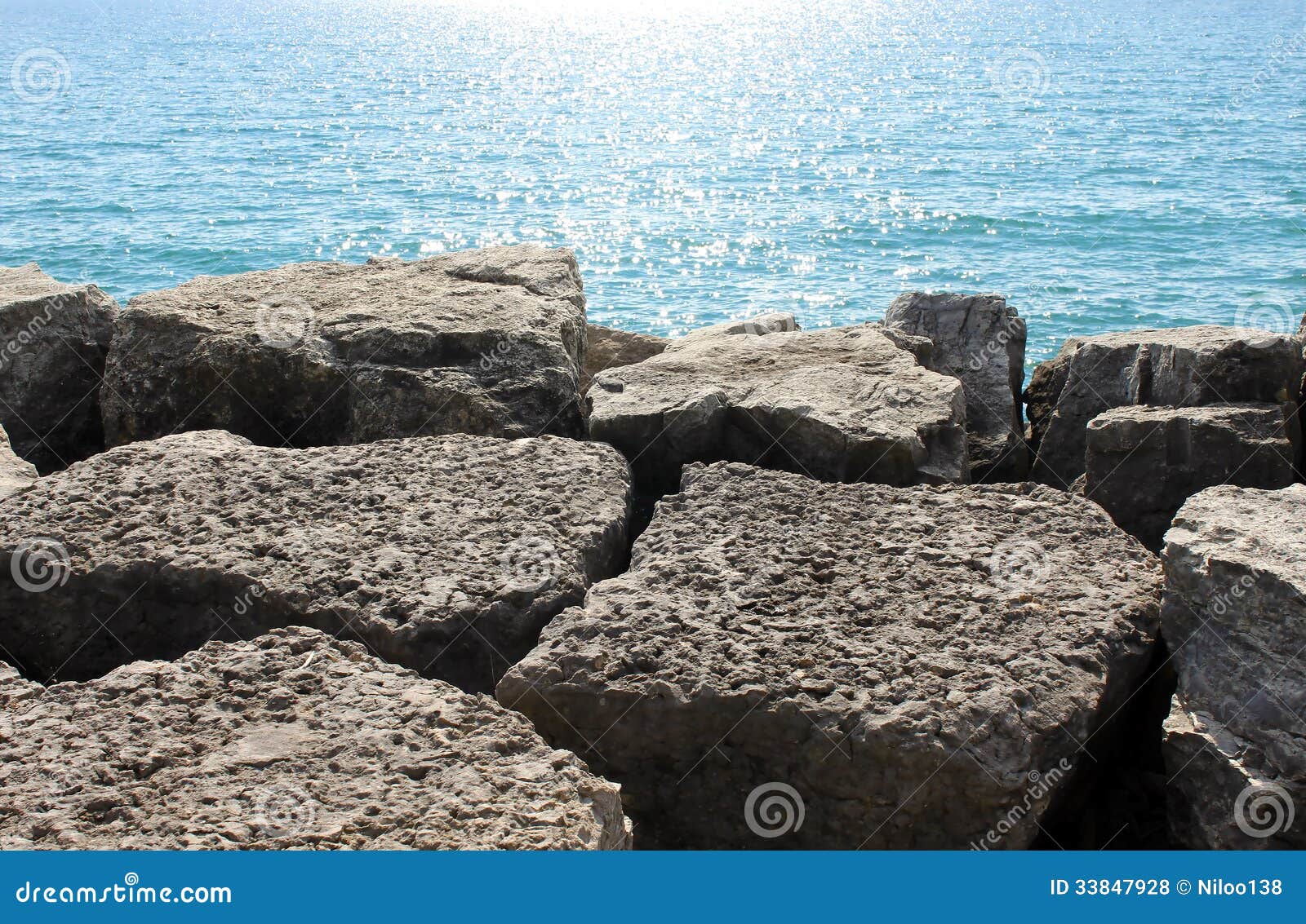 Boulders and Sparkling Blue Lake Stock Photo - Image of horizon, calm ...