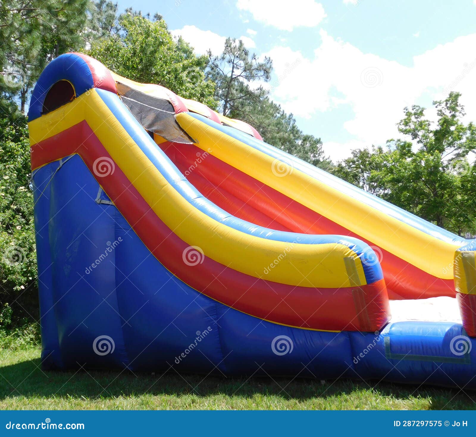 Bounce House Slide Outside on Sunny Day Stock Image - Image of green ...