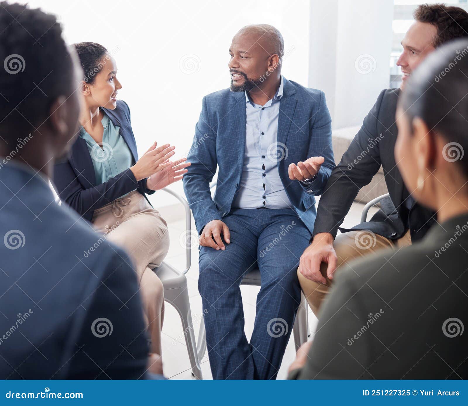 Bouncing Ideas Off of Each Other. a Group of Businesspeople in a ...