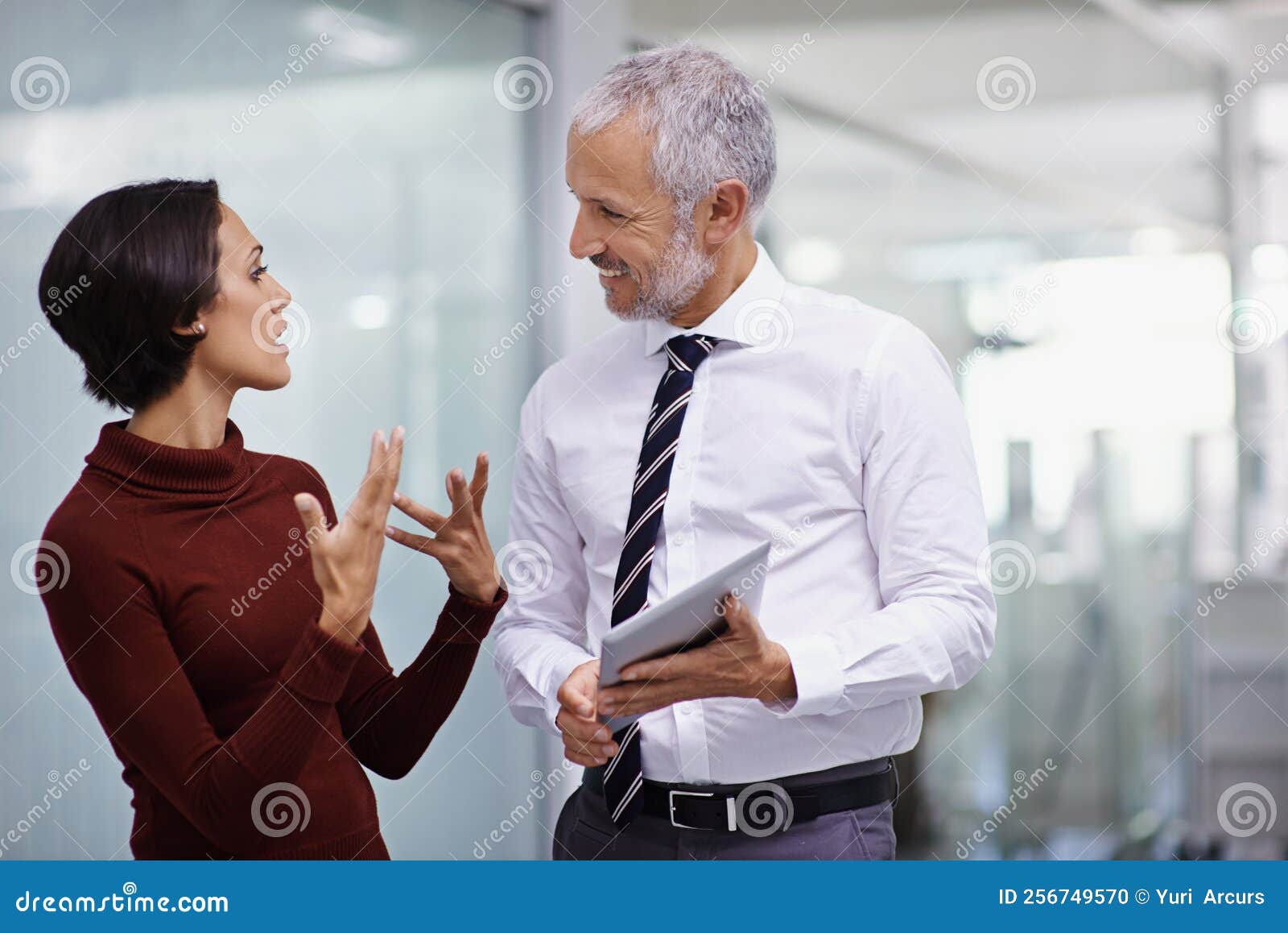 Bouncing Ideas Off Each Other. Two Colleagues Looking at a Tablet ...