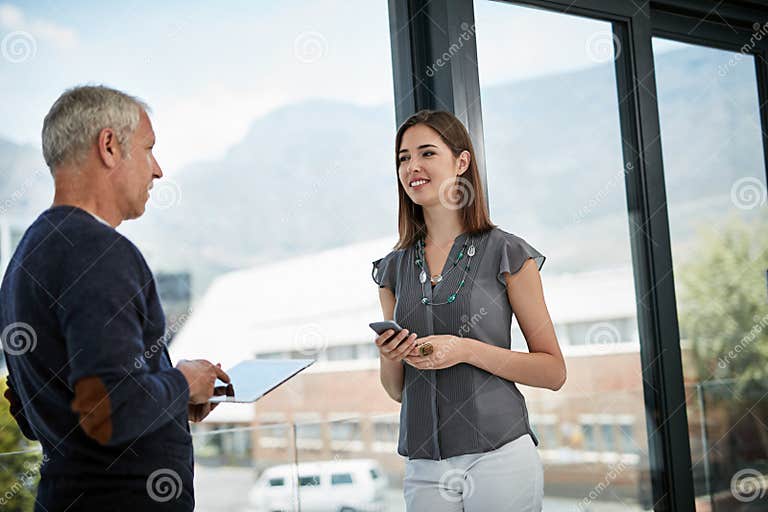 Bouncing Ideas Off Each Other. Two Colleagues Talking in an Office ...