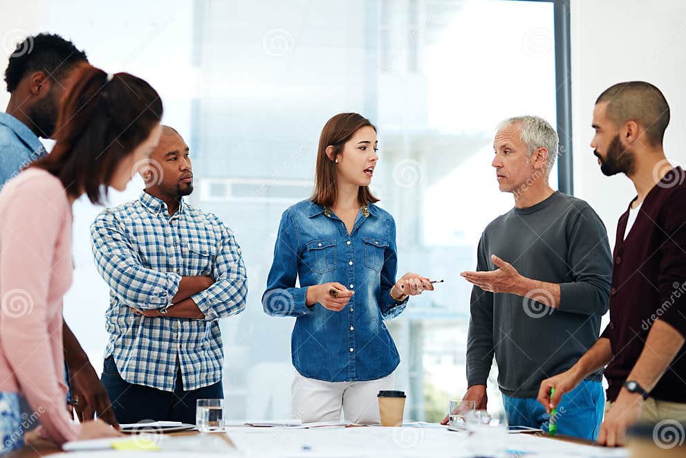 Bouncing Ideas Off of One Another. a Group of Architects Working on ...