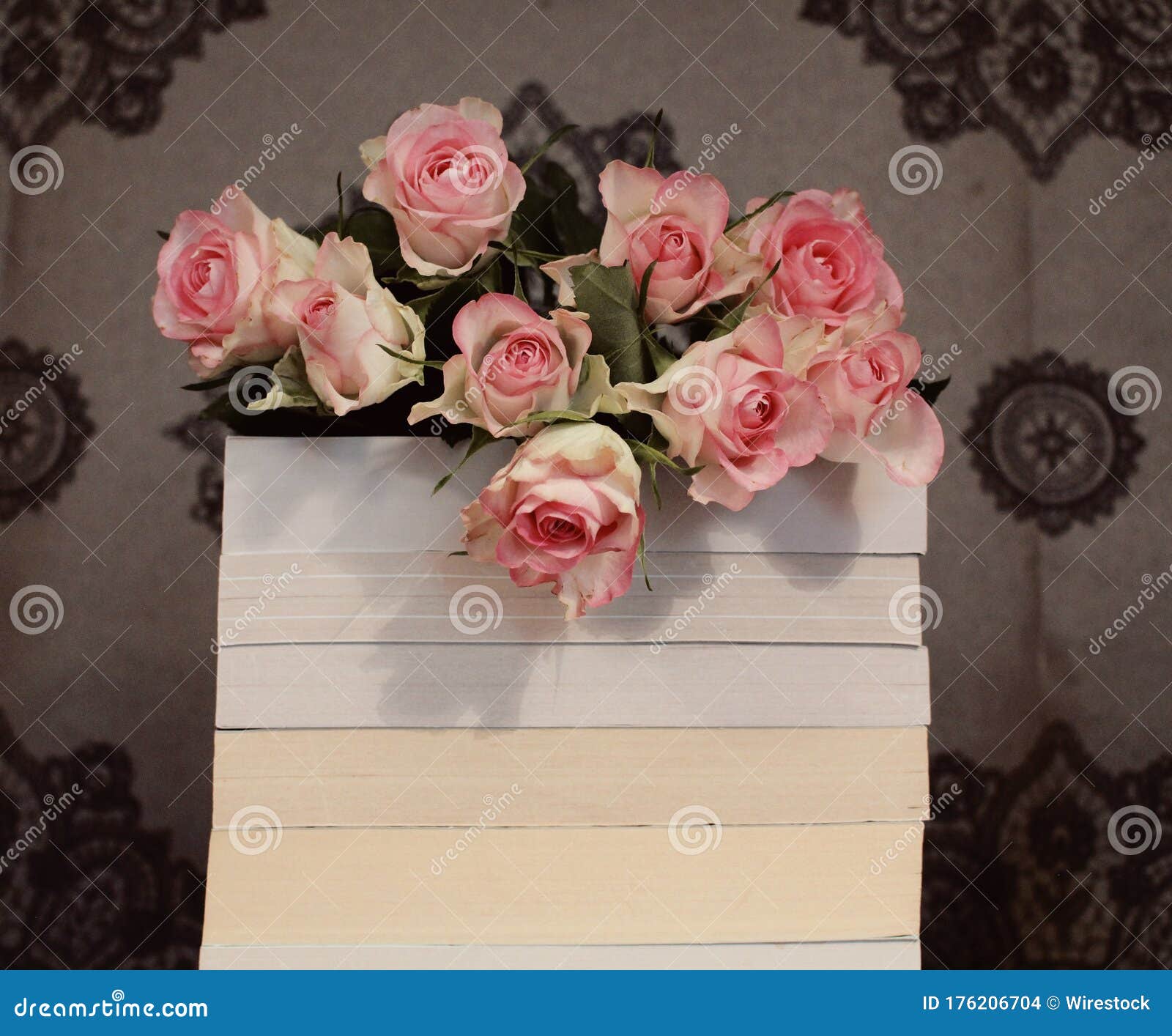 Bouquet of Beautiful Pink Roses on a Stack of Books Stock Photo - Image ...
