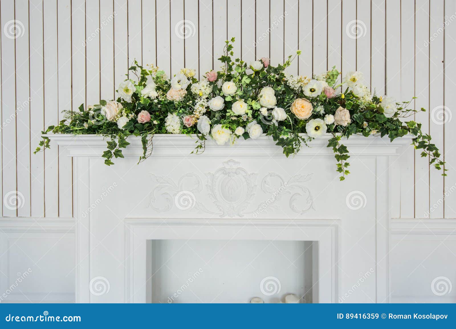 Bouquet of Flowers Over White Fireplace in Classic Interior. Stock ...