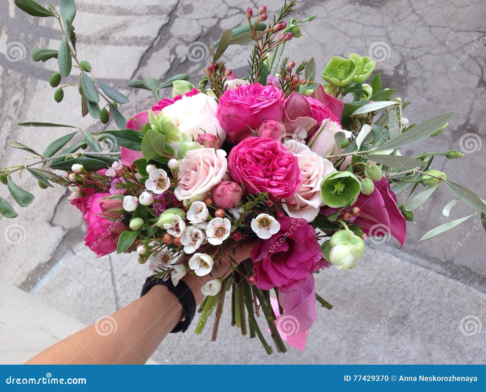 Bouquet in hand stock photo. Image of floristry, summer - 77429370