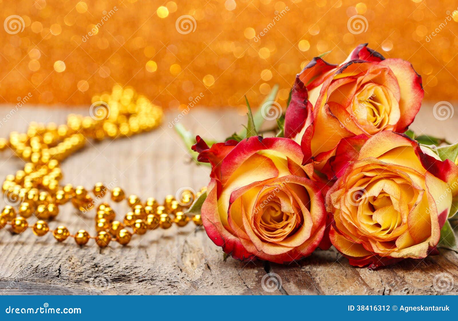 Bouquet of Orange and Red Roses on Wooden Table Stock Photo - Image of ...