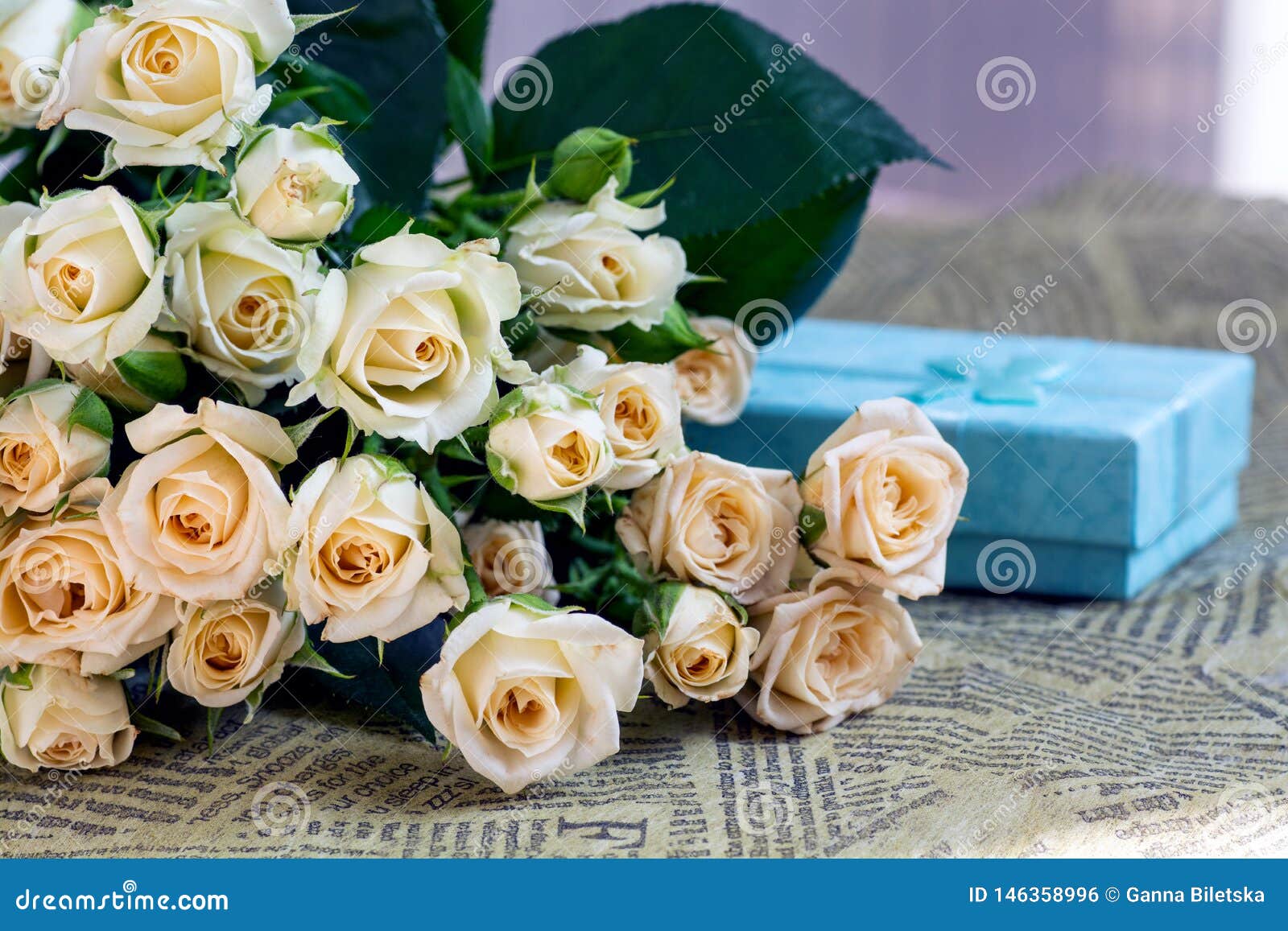 A Bouquet of Roses with a Gift Stock Photo - Image of roses, grow ...