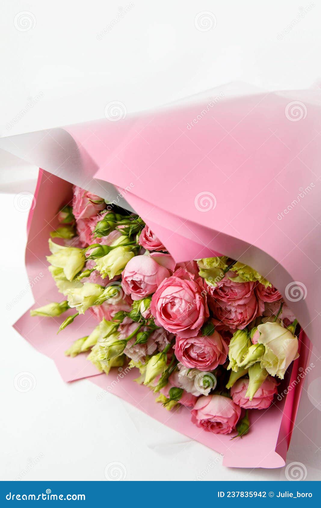 Bouquet of Roses in a Paper Wrapper Close Up Stock Photo - Image of ...