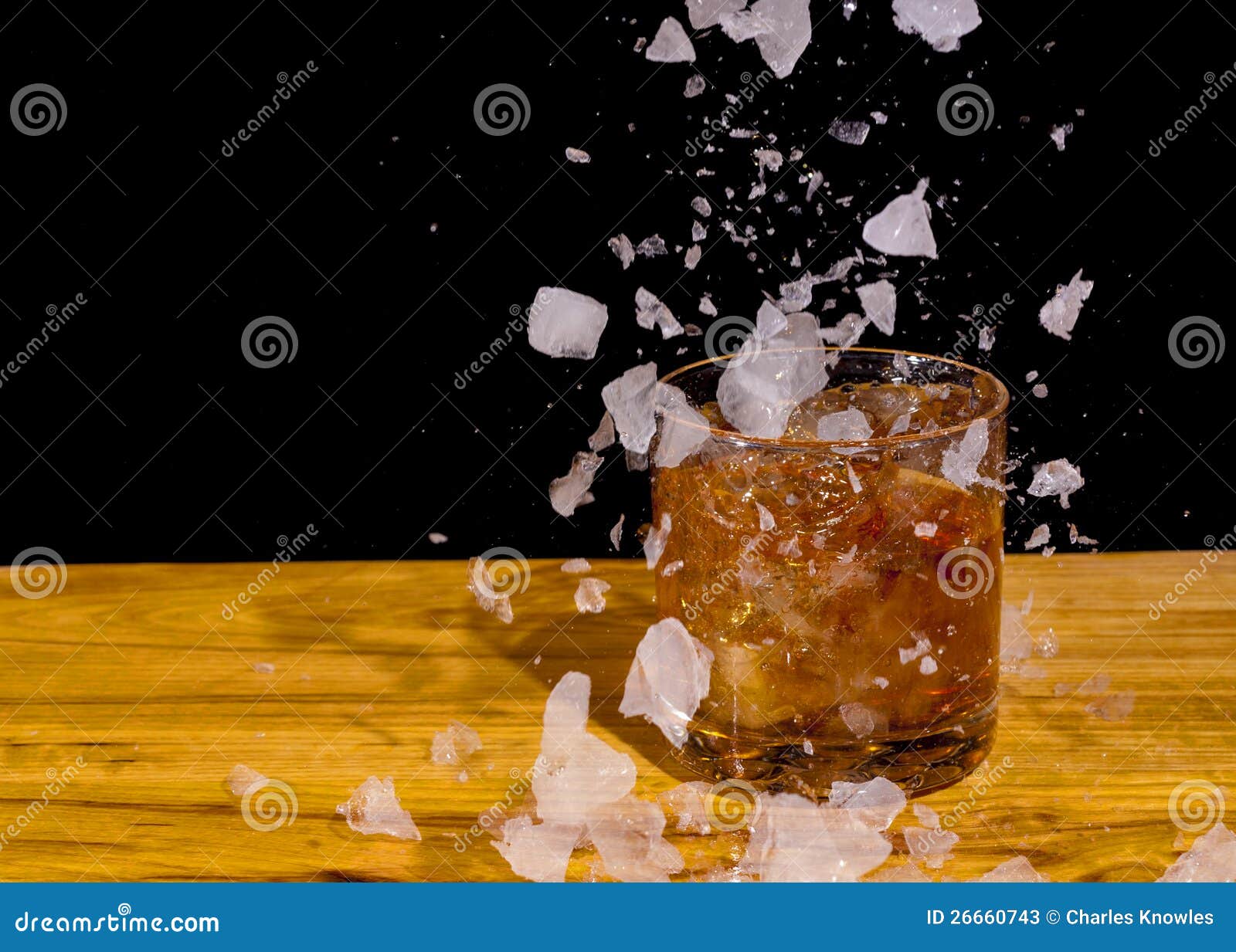 Bourbon in a Glass with Ice Falling into it Stock Image - Image of ...