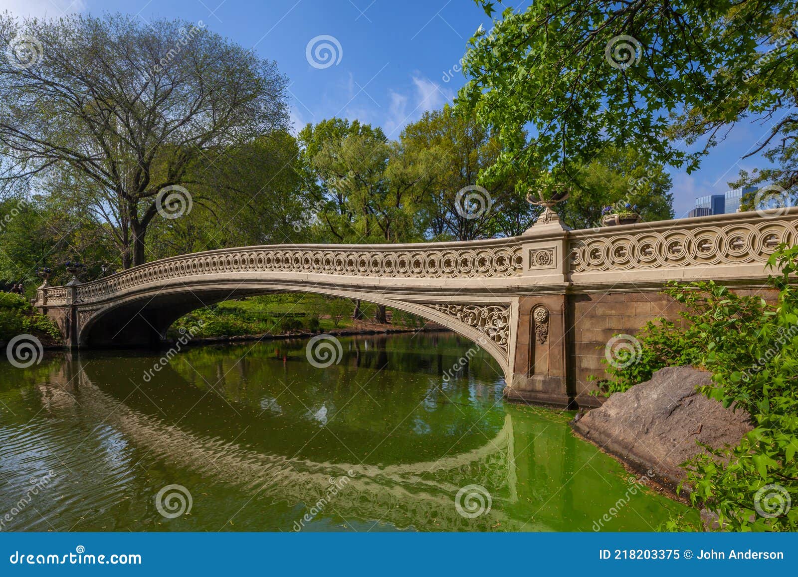 Bow bridge in early spring stock image. Image of garden - 218203375