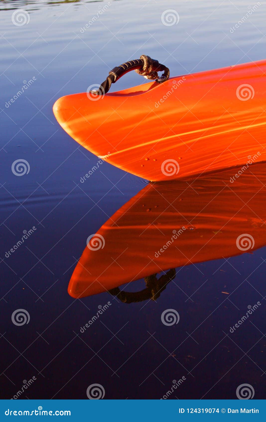 Bow of Orange Kayak Reflects on Still Water Stock Photo - Image of ...