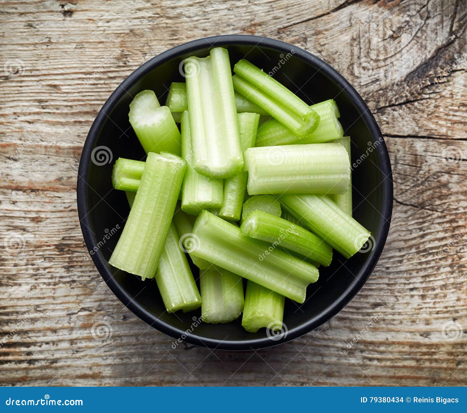 Bowl of Celery on Wooden Table, from Above Stock Photo - Image of ...