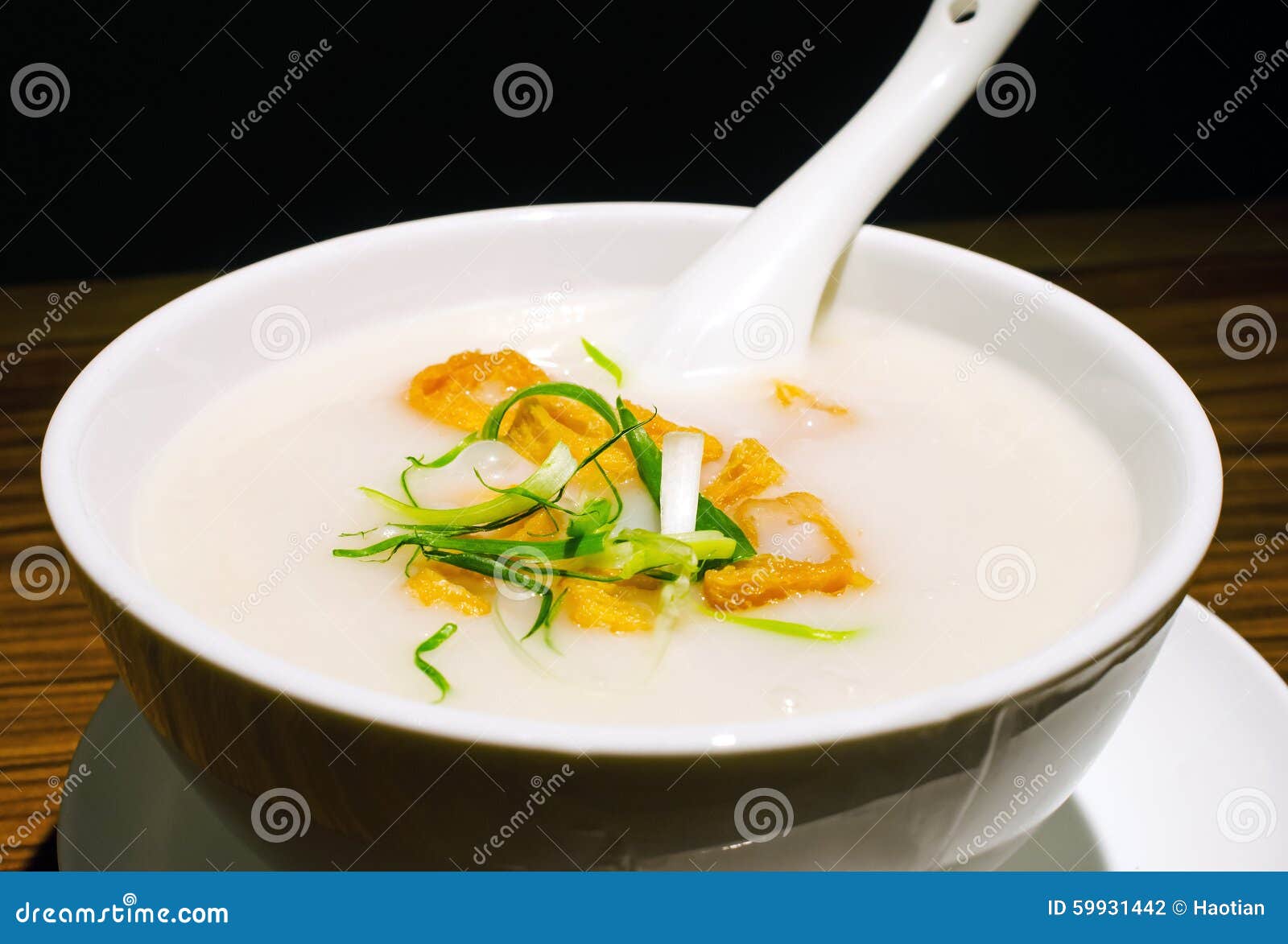 Bowl of Chinese congee stock photo. Image of crackers - 59931442