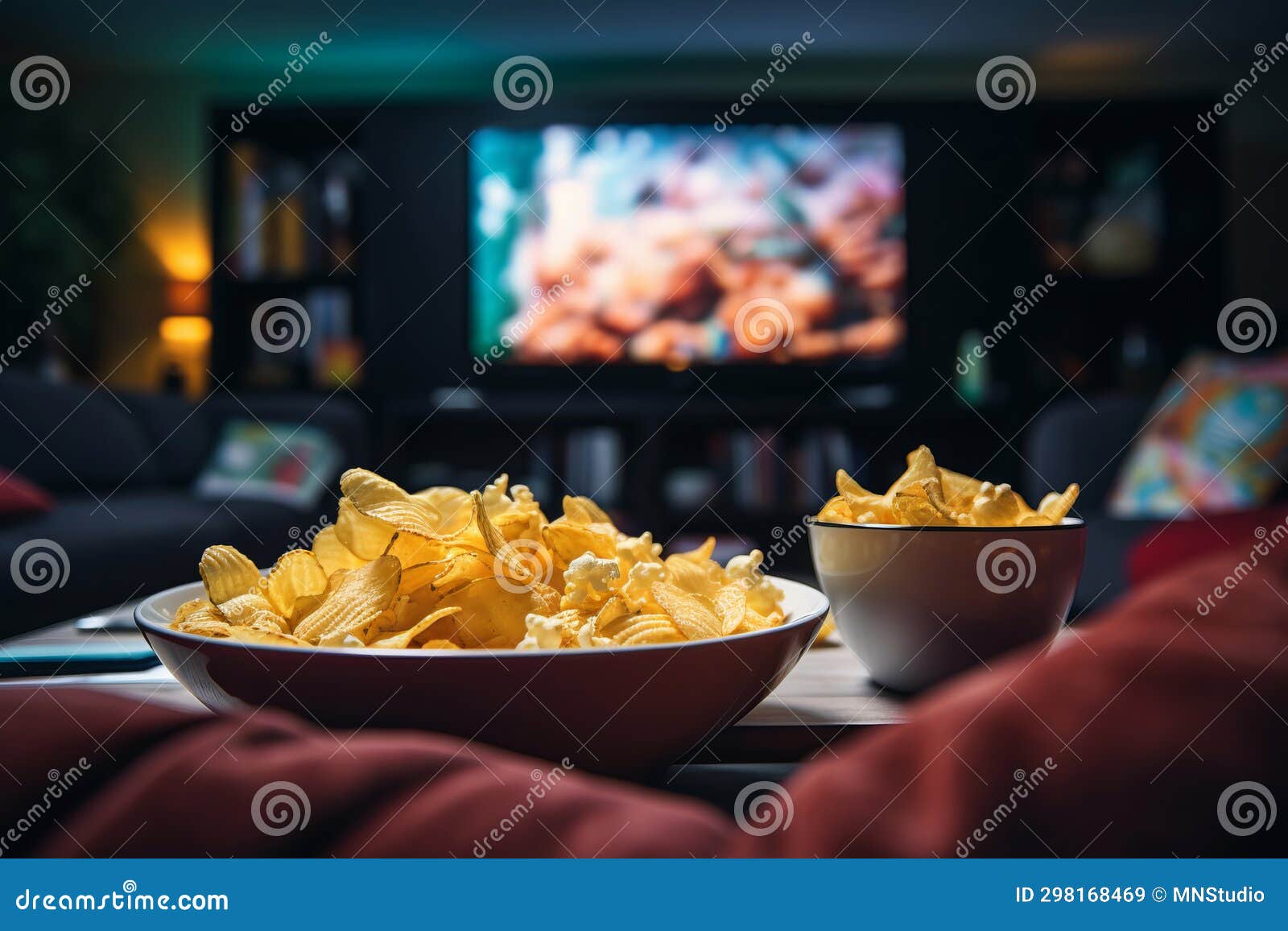 Bowl of Chips in Front of TV Screen. Watching Television at Home Stock ...