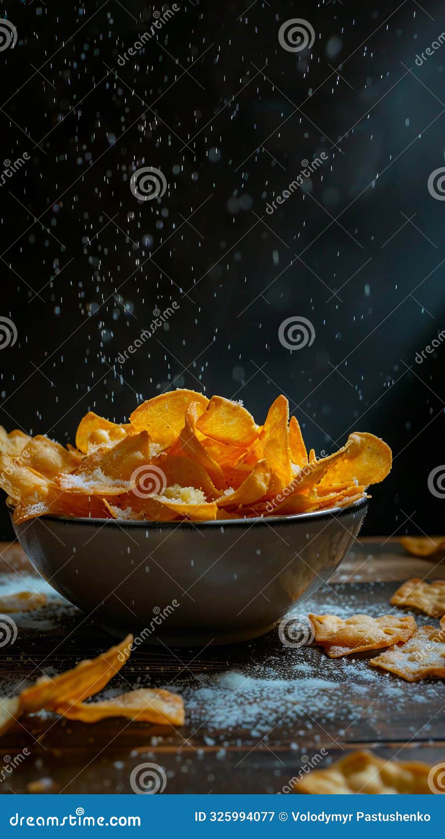 A Bowl of Chips with Powder Falling on Top Stock Image - Image of ...