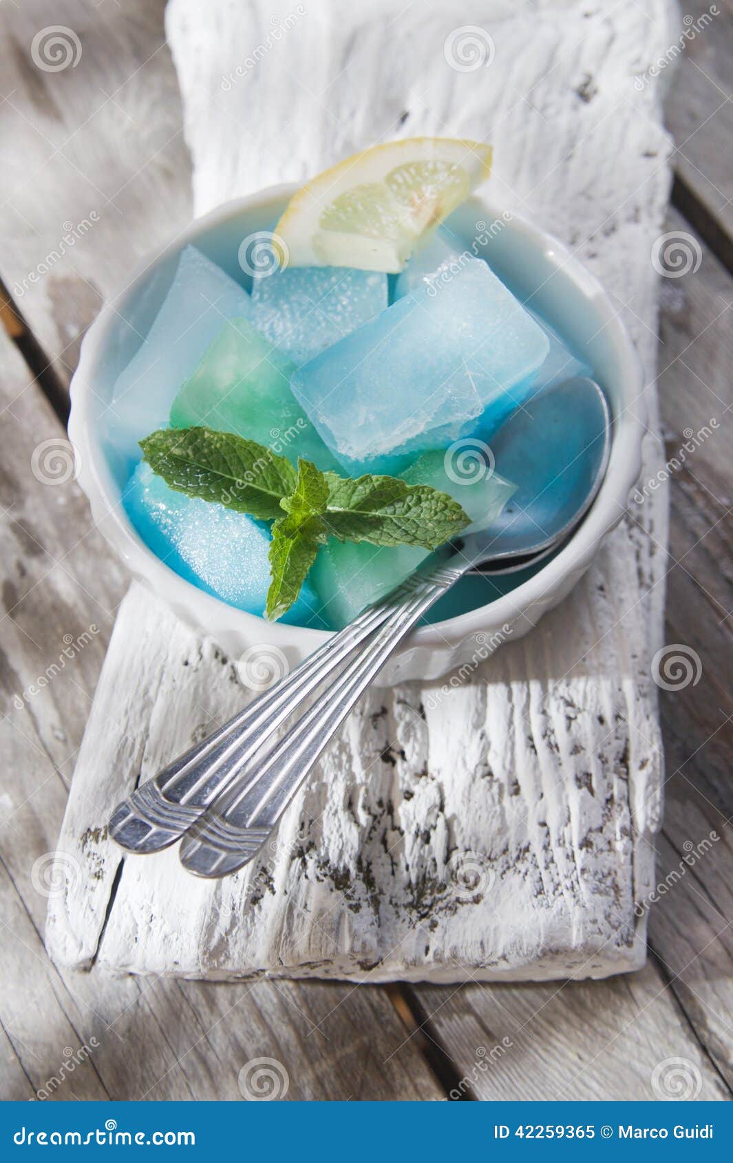Bowl of colored ice-cubes stock image. Image of solid - 42259365