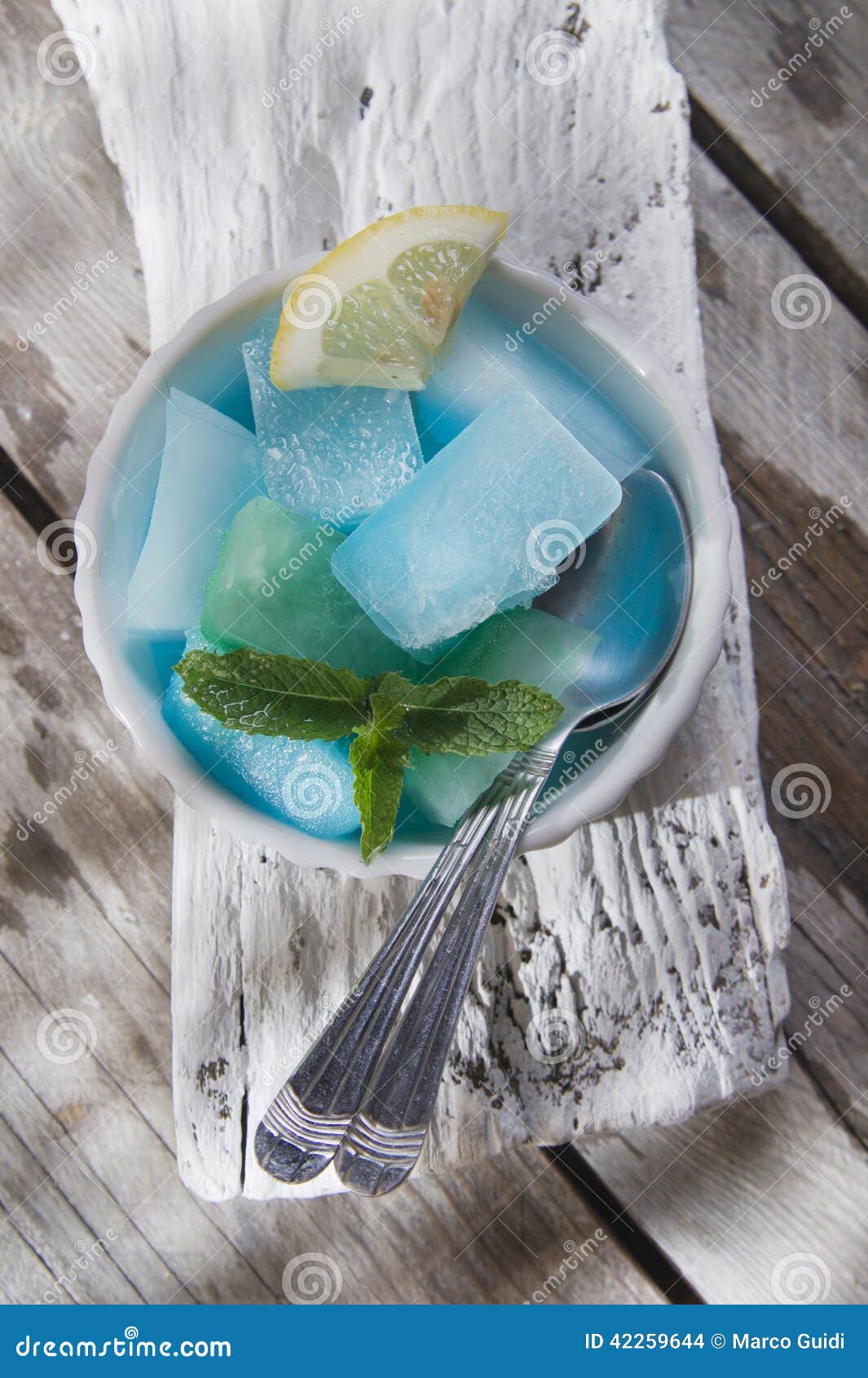 Bowl of colored ice-cubes stock photo. Image of fresh - 42259644