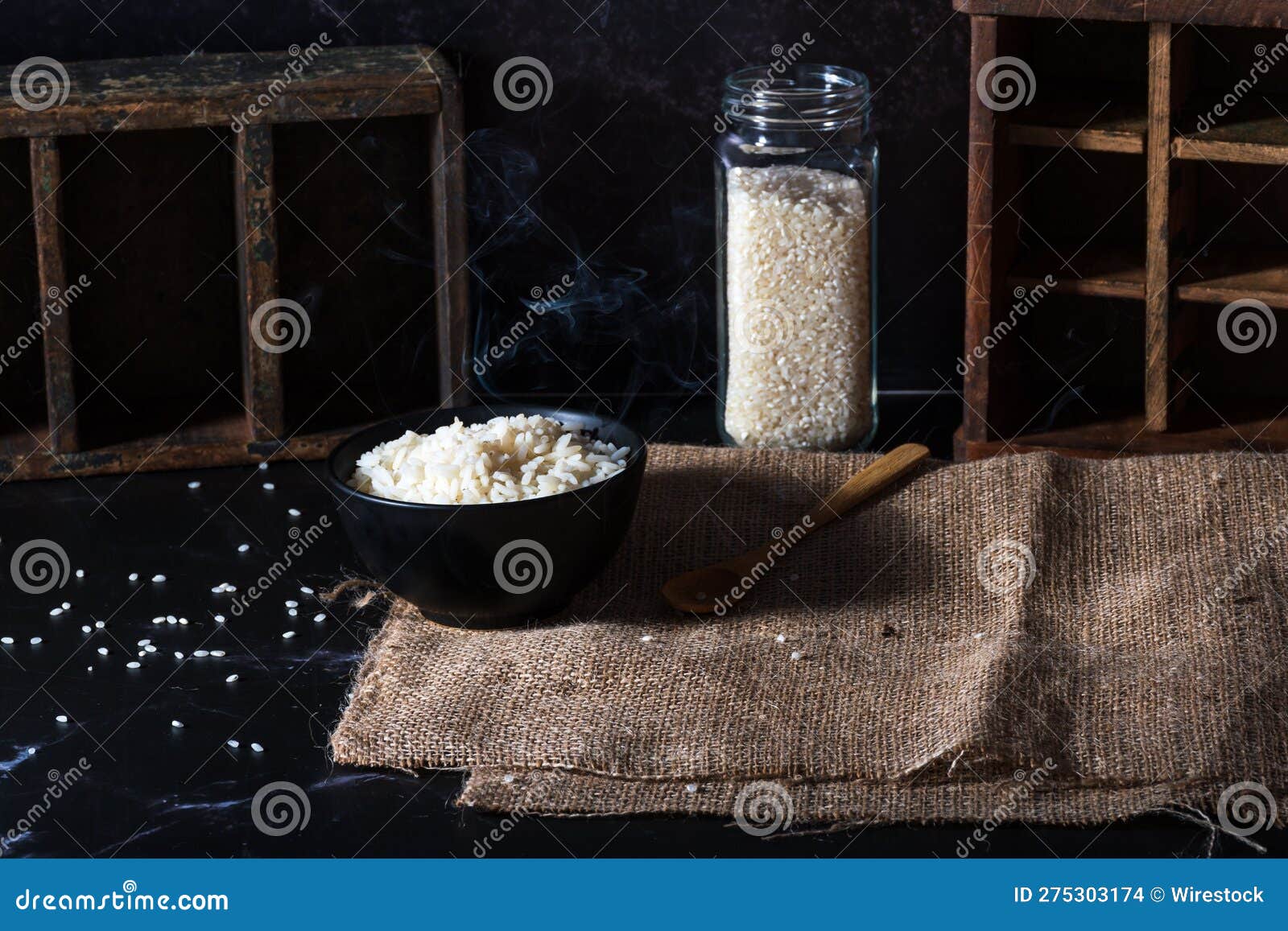 Bowl of Cooked White Rice Smoking and Glass Jar with Uncooked Rice ...