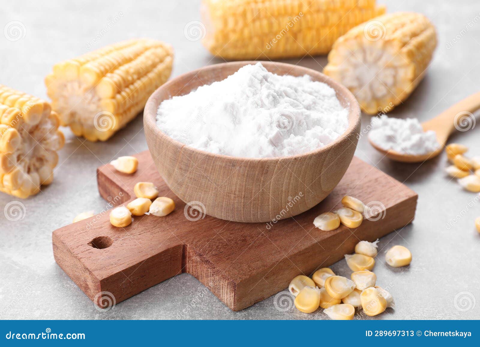 Bowl with Corn Starch and Kernels on Light Grey Table, Closeup Stock ...
