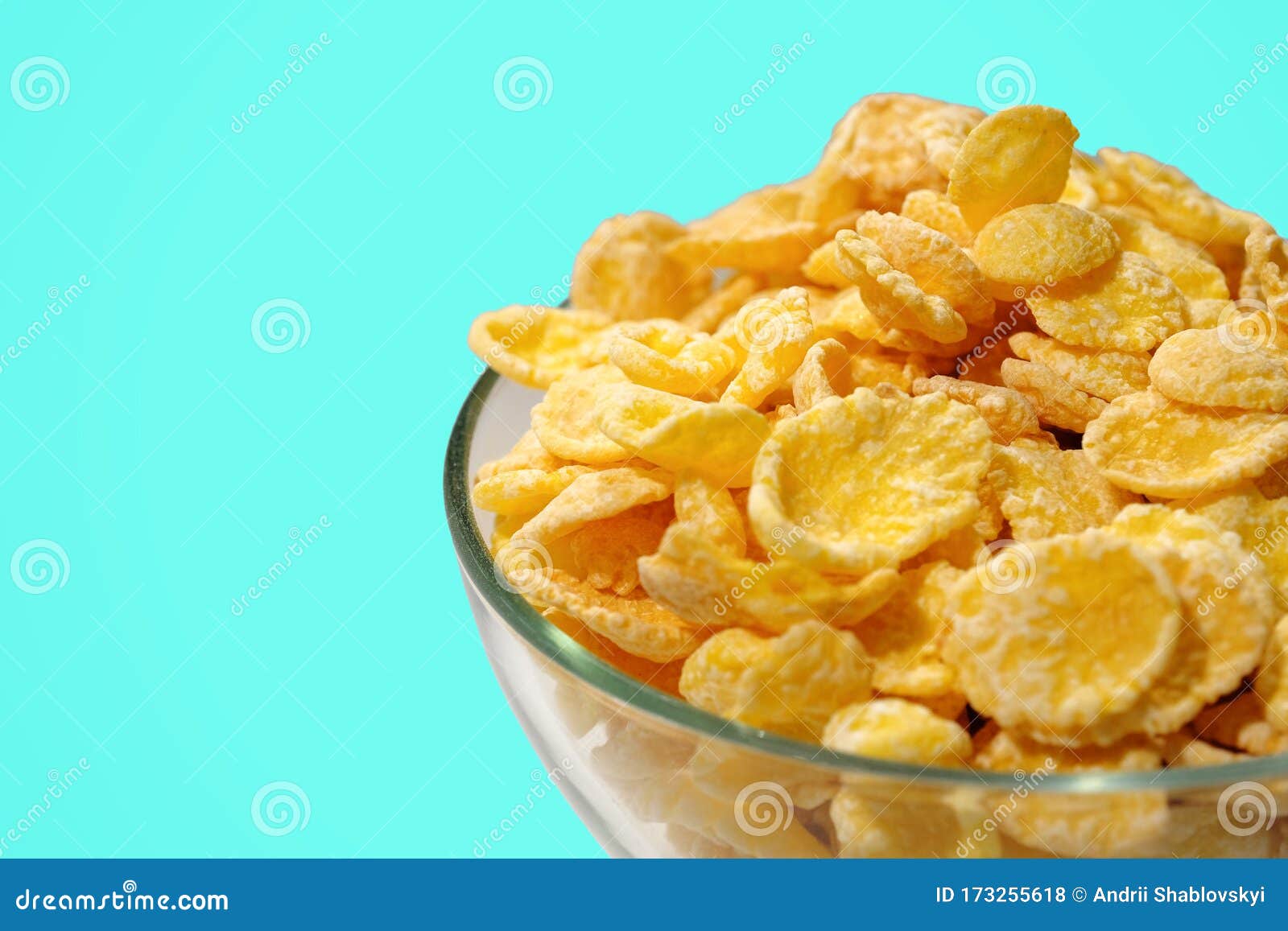 A Bowl of Cornflakes on a Blue Background. Close-up Stock Photo - Image ...