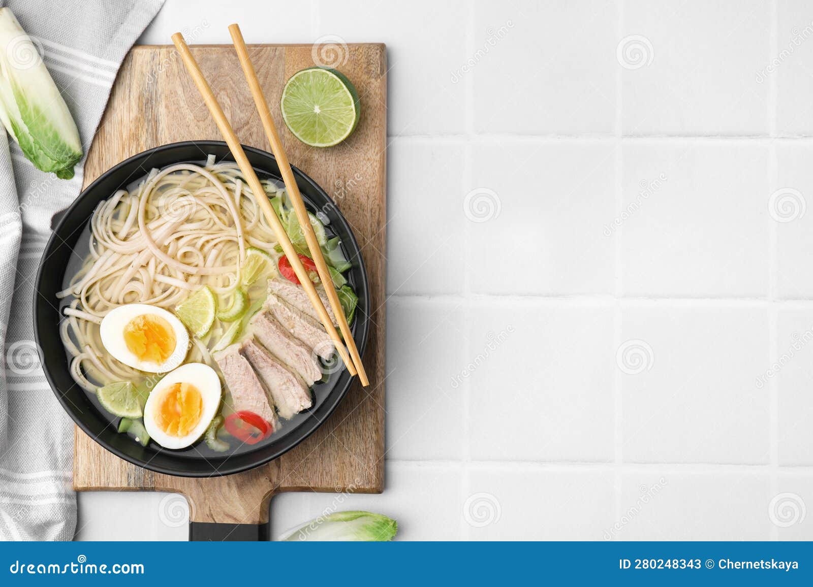 Bowl of Delicious Rice Noodle Soup with Meat and Egg on White Tiled ...