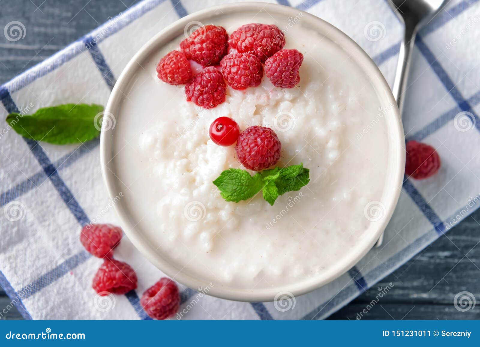 Bowl with Delicious Rice Pudding and Berries on Napkin Stock Image ...