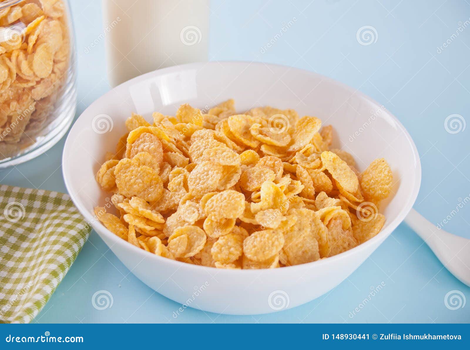 A Bowl of Dry Corn Flakes Cereal on Blue Background Stock Image - Image ...