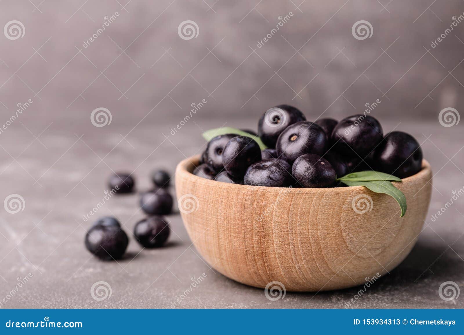 Bowl of Fresh Acai Berries on Grey Stone Table, Closeup. Stock Image ...