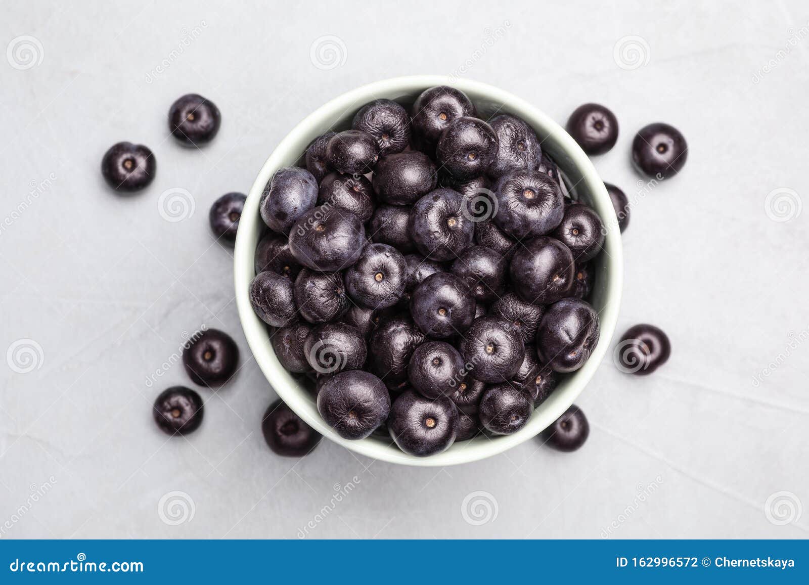 Bowl of Fresh Acai Berries on Light Stone Table. Space for Text Stock ...