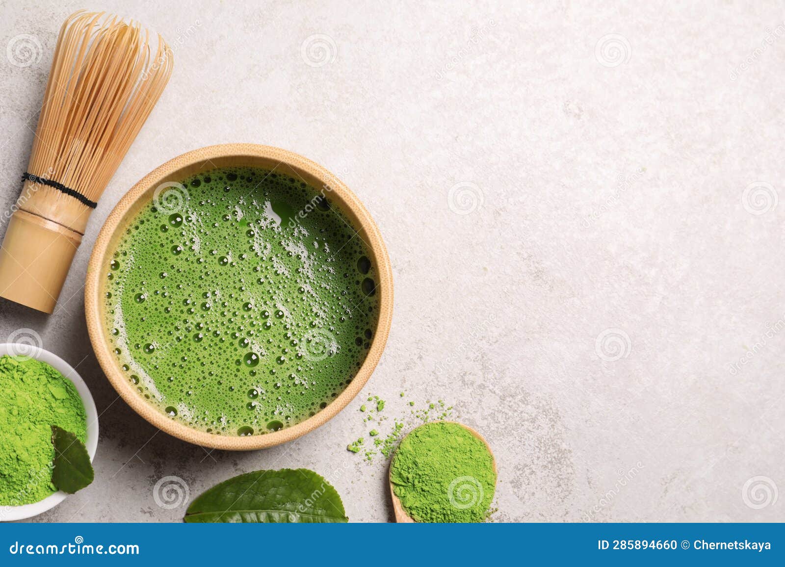 Bowl of Fresh Matcha Tea, Bamboo Whisk and Powder on Light Table, Flat ...