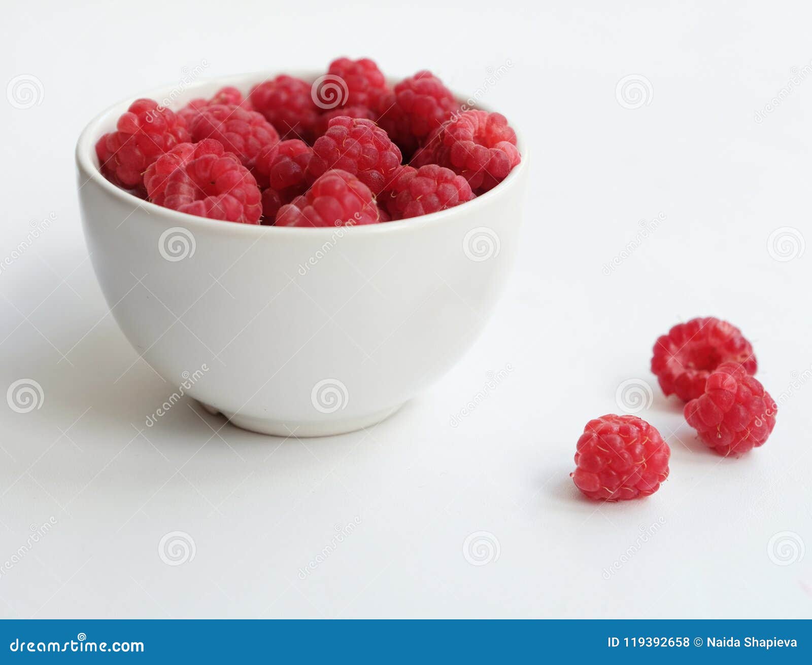 Raspberries in white bowl stock photo. Image of object - 119392658
