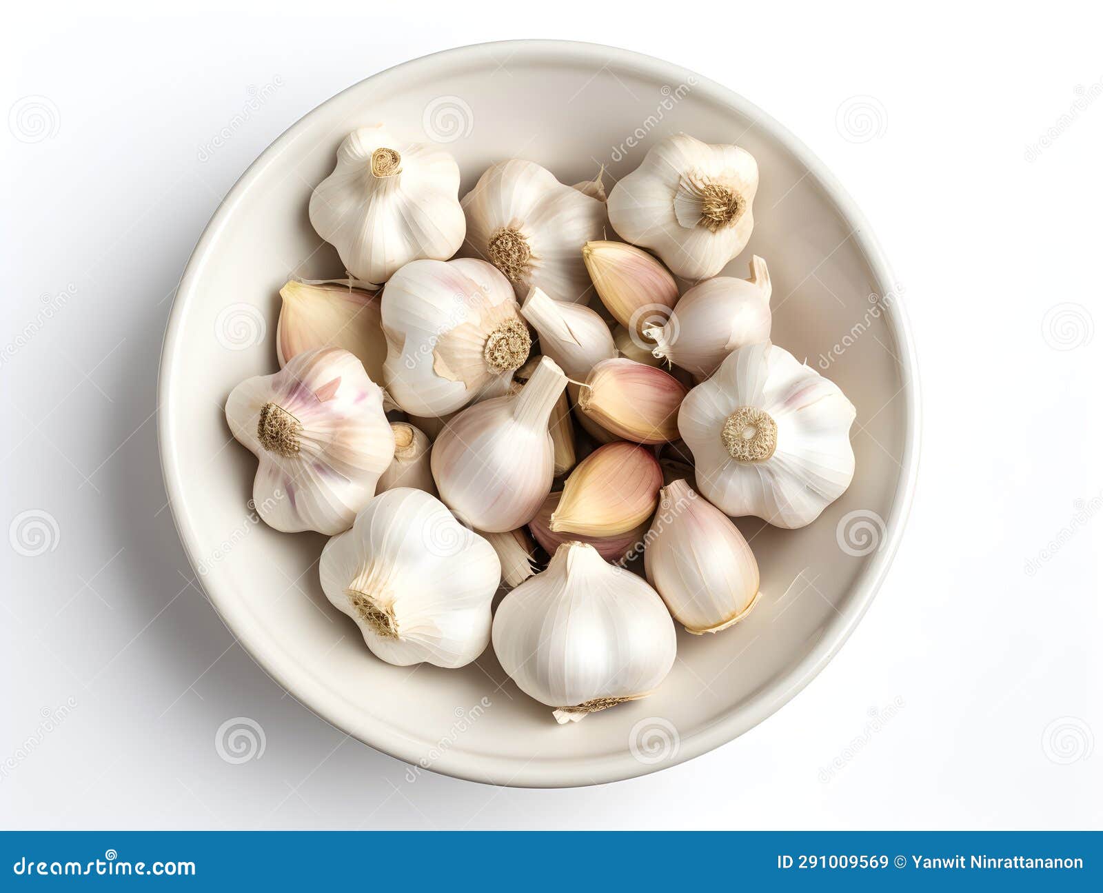 A Bowl of Garlic on a White Background, with a Close-up of the Cloves ...