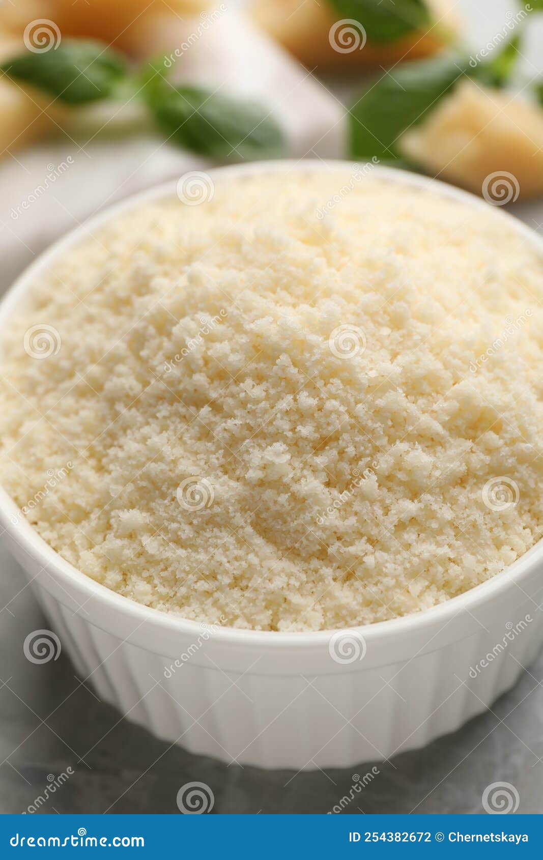 Bowl with Grated Parmesan Cheese on Table, Closeup Stock Photo - Image ...