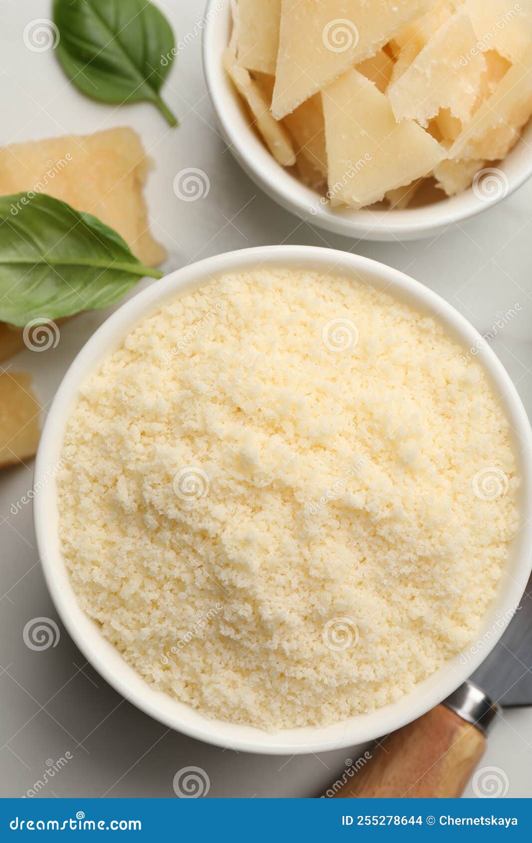 Bowl with Grated Parmesan Cheese on White Table, Flat Lay Stock Photo ...