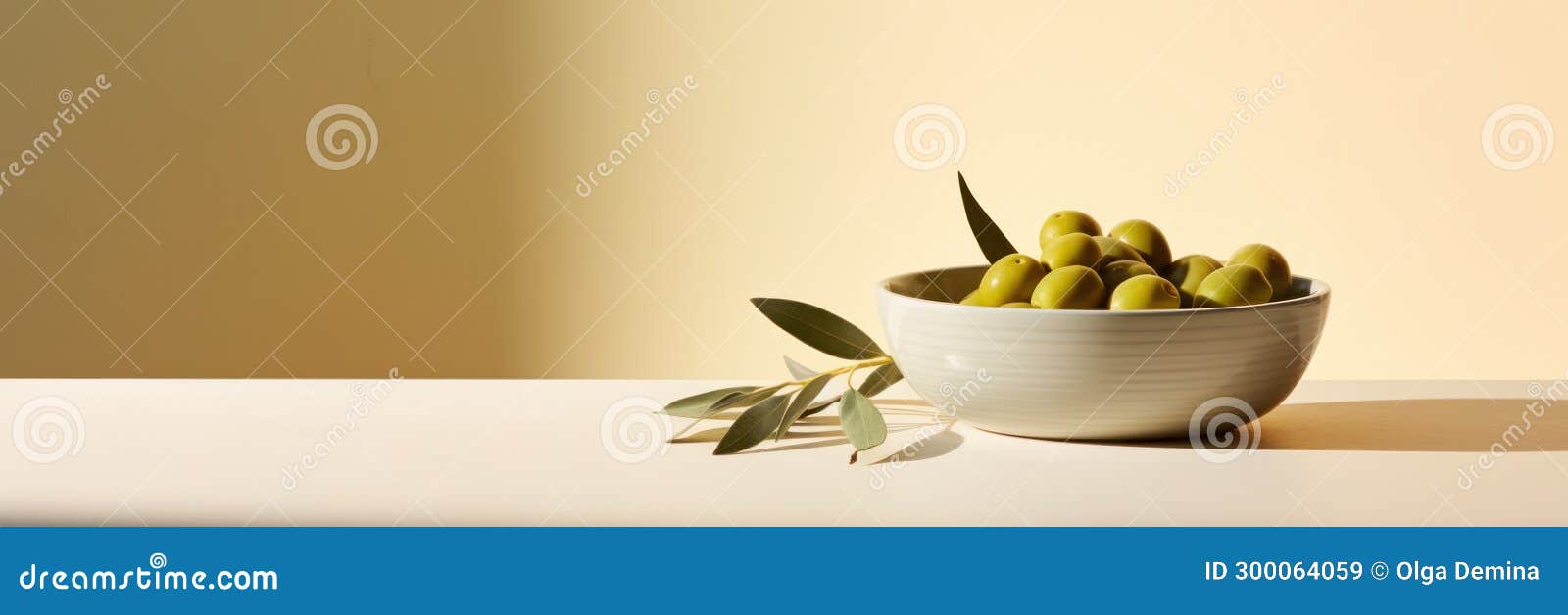 Bowl of Green Olives Cast in Soft Shadows on a Plain Surface ...