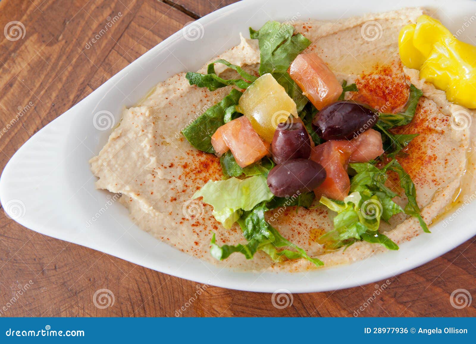Bowl of Hummus Topped with Salad Stock Photo - Image of hummus ...