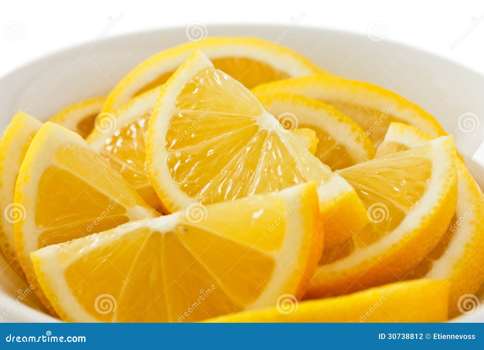 Bowl of lemon slices stock photo. Image of close, citrus - 30738812