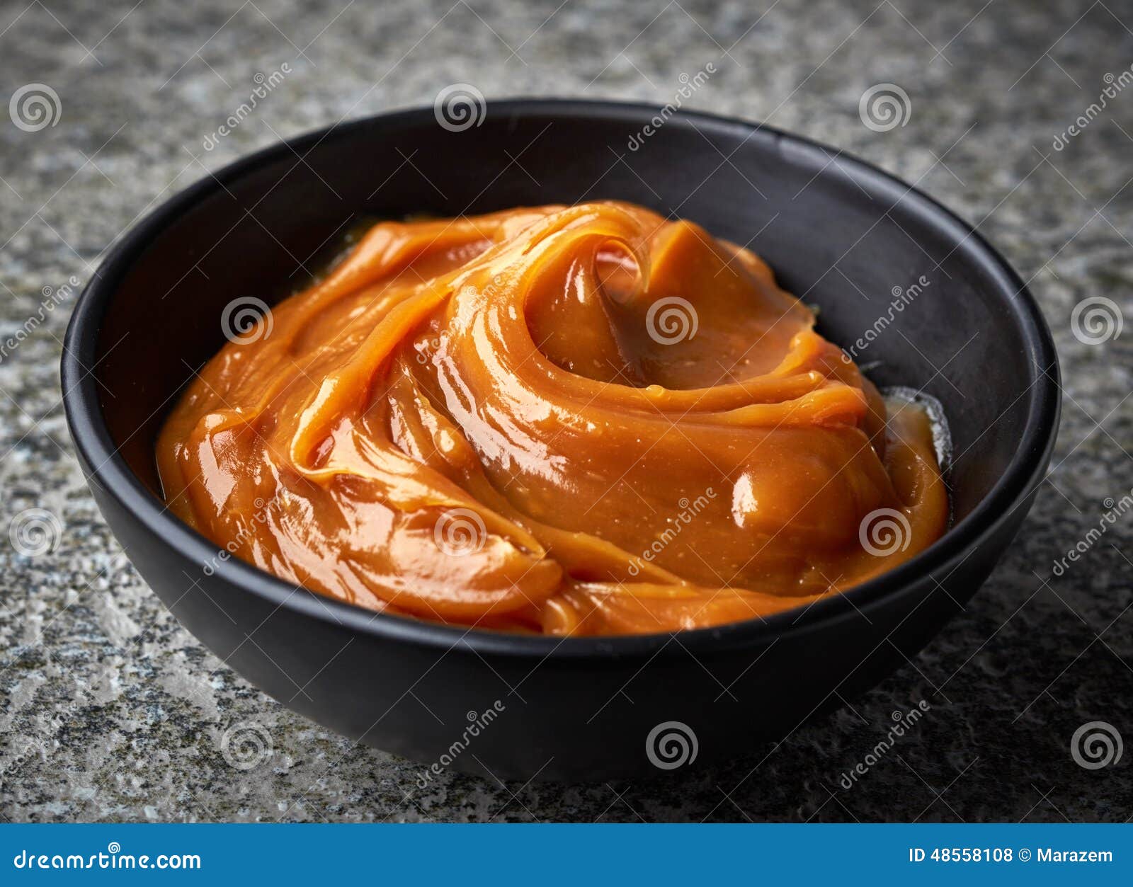 Bowl of Melted Caramel Cream Stock Photo - Image of pudding, black ...
