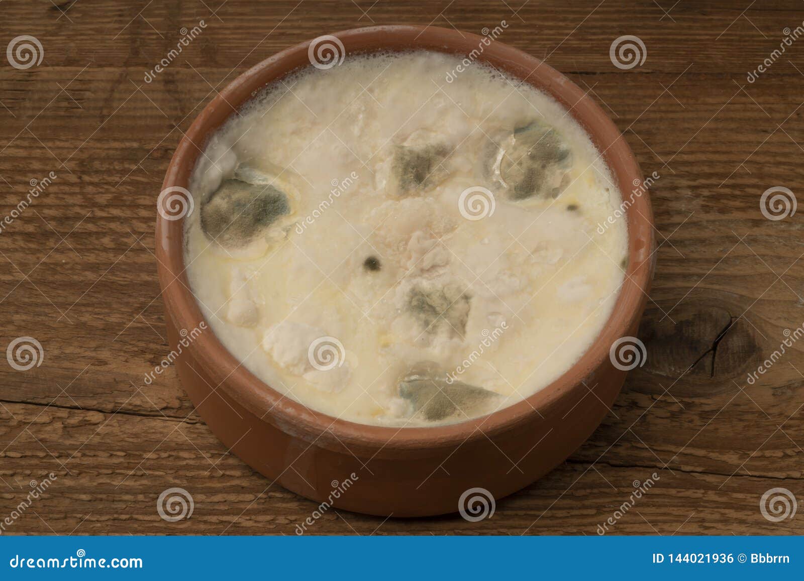 A Bowl of Moldy Yogurt on Wooden Table Stock Photo - Image of dairy ...