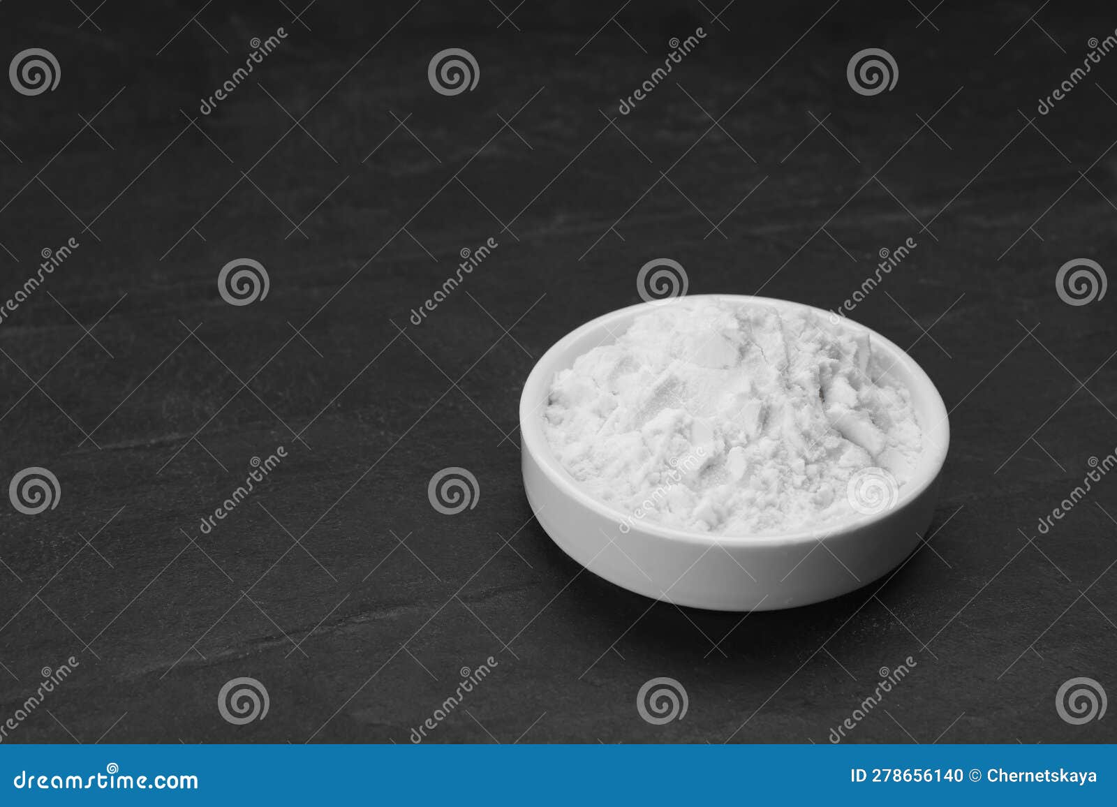 Bowl of Natural Starch on Black Table, Space for Text Stock Photo ...