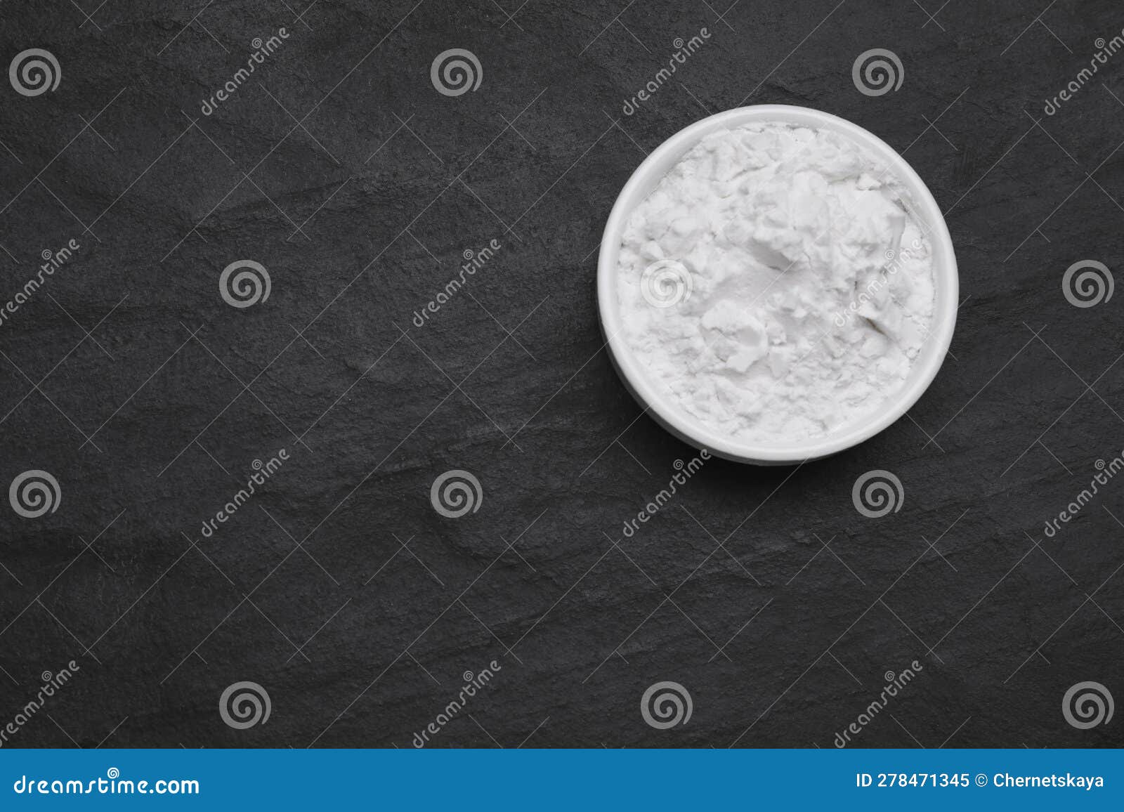 Bowl of Natural Starch on Black Table, Top View. Space for Text Stock ...