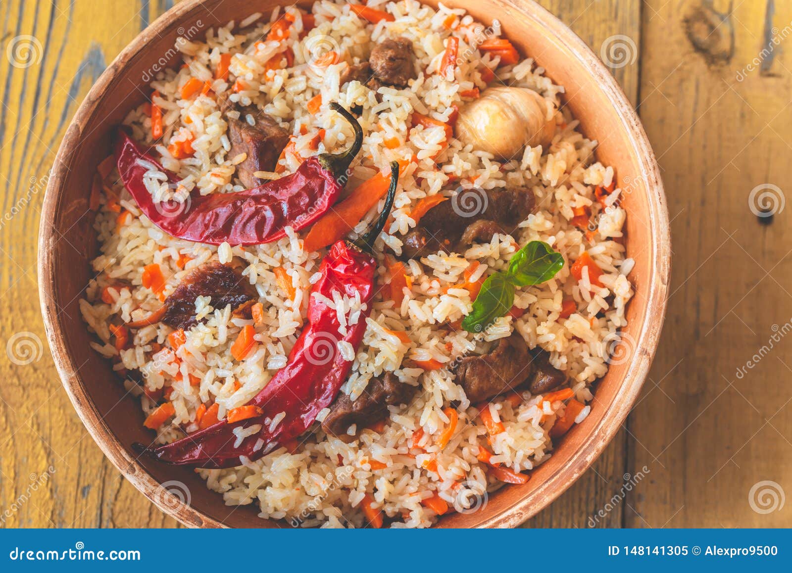 Bowl of Pilaf on the Wooden Table Stock Image - Image of long, meat ...