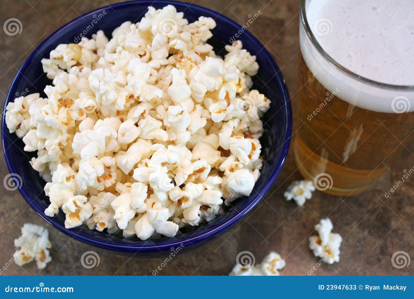 Bowl of popcorn and beer stock image. Image of food, popcorn - 23947633
