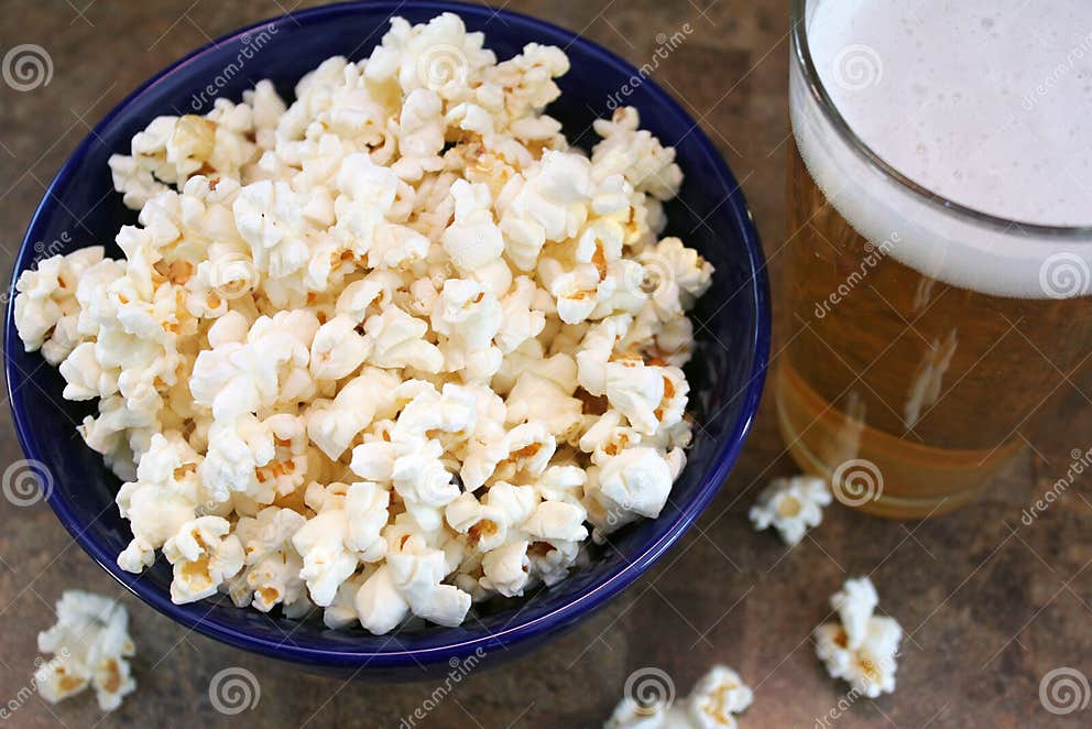 Bowl of popcorn and beer stock image. Image of food, popcorn - 23947633