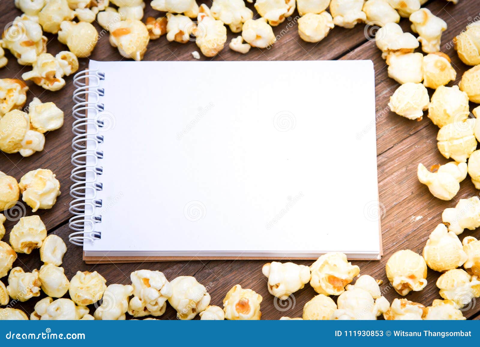 A Bowl of Popcorn and Notebook on a Wooden Table Stock Image - Image of ...