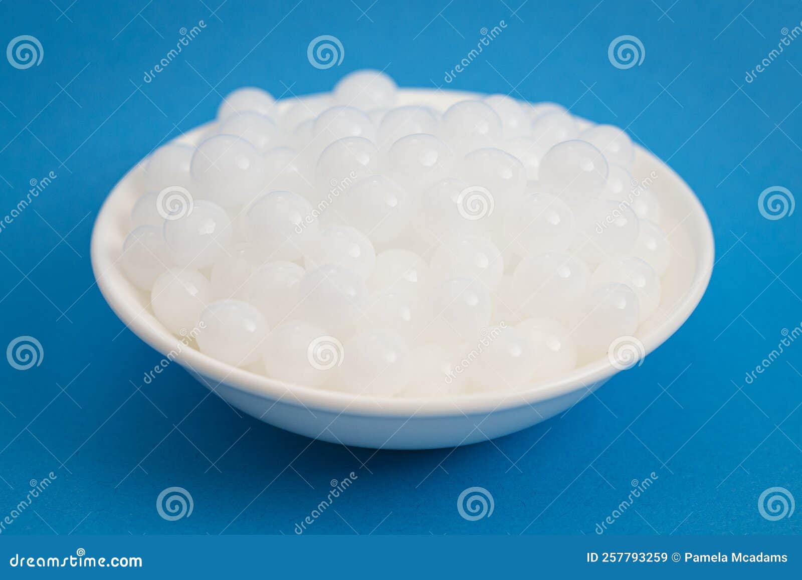 Bowl of Popping Boba Pearls on a Bright Blue Background Stock Image ...
