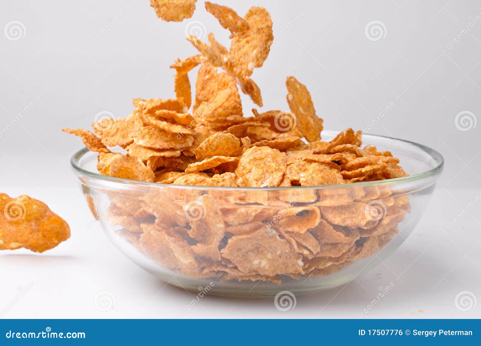Bowl with Pouring Brown Cereal Flakes Stock Photo - Image of full ...