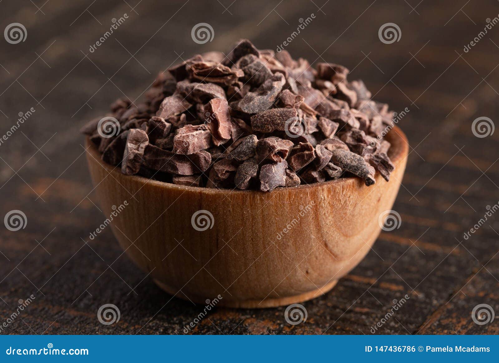 Bowl of Raw Chocolate Nibs on a Rustic Wooden Table Stock Photo - Image ...
